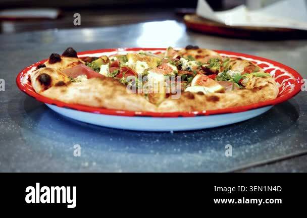 Authentic pizza making process in traditional Italian pizzeria, while ...