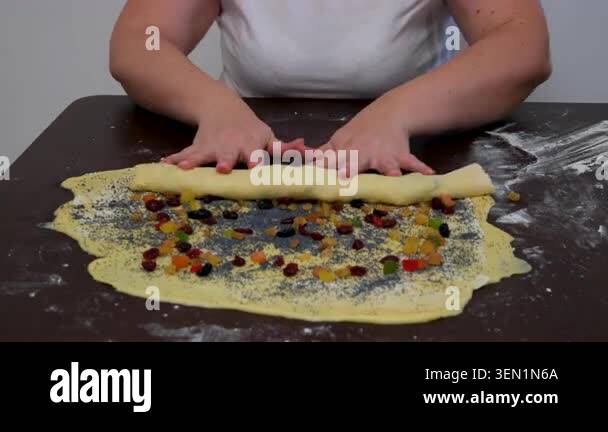 series of baking videos shows a woman rolling soft yeast dough filled ...