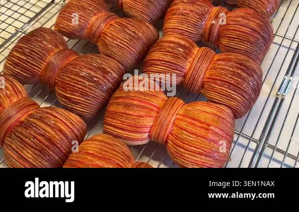 Golden bow shaped pastries made from flaky puff dough are beautifully ...