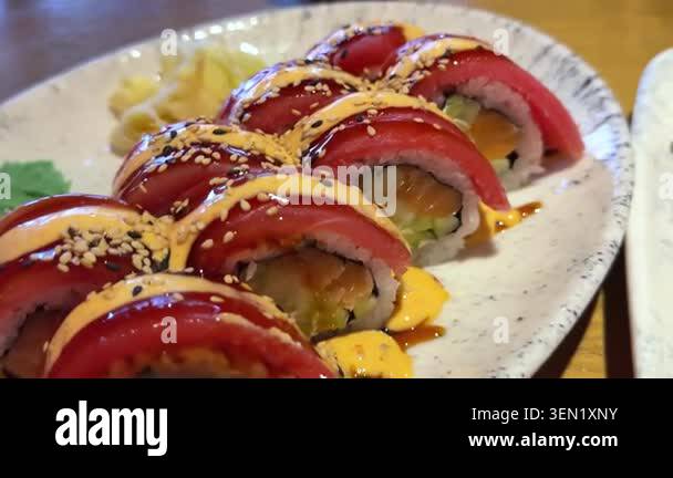 Large tuna sushi rolls topped with creamy japanese mayonnaise ...