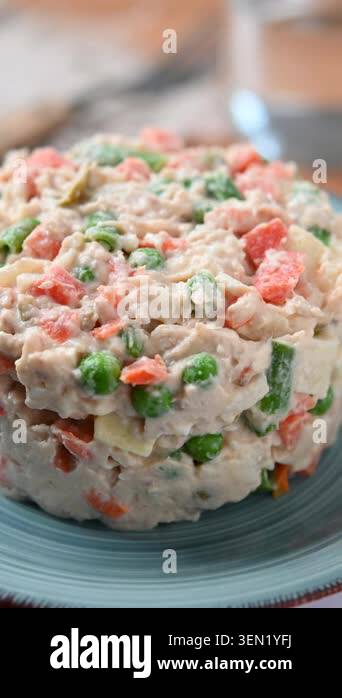 Rotating Russian salad on wooden table Stock Video Footage - Alamy