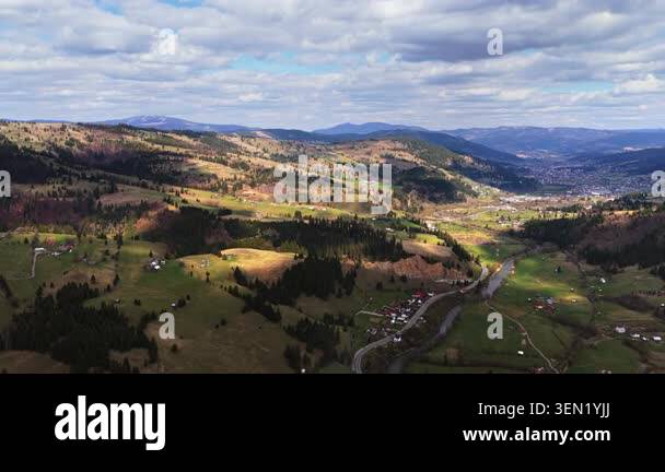 Aerial drone view of layered hills and valleys extending into the ...