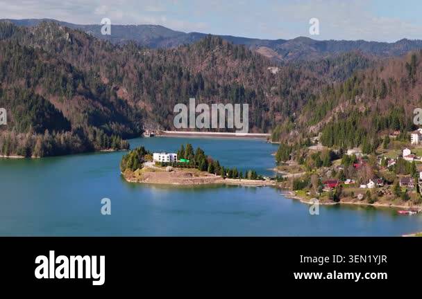Aerial drone view of the Colibita lake with a small peninsula with ...