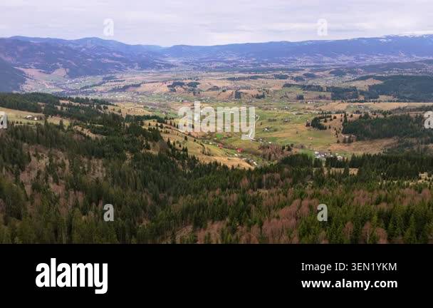 Aerial drone view of the valley near Tihuta Pass, Romania. Scattered ...