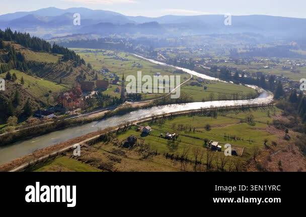 Aerial drone view of a winding river forming a dramatic bend in Dorna ...