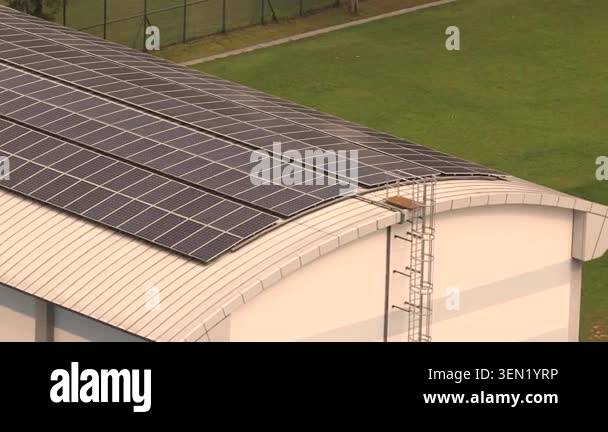 Solar panels on industrial warehouse roof for renewable energy ...