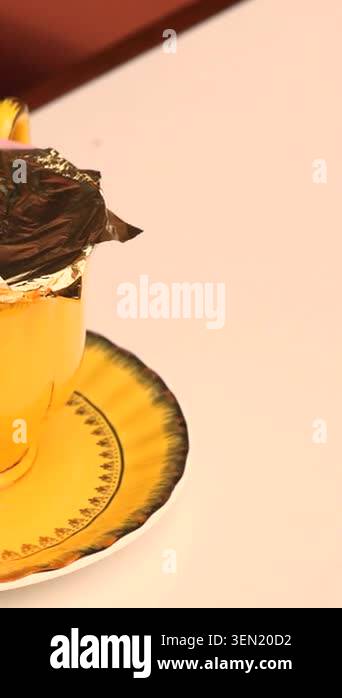 Golden cappuccino in stylish cup symbolizing luxury wealth and ...
