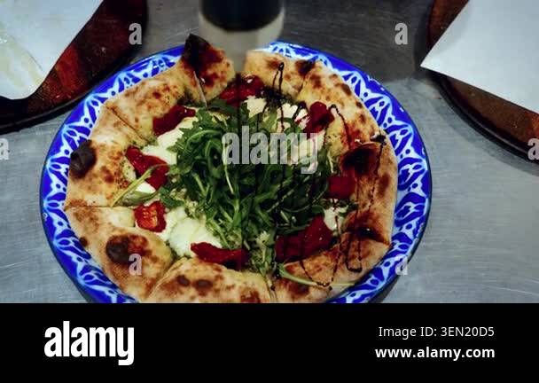 Authentic pizza making process in traditional Italian pizzeria, while ...