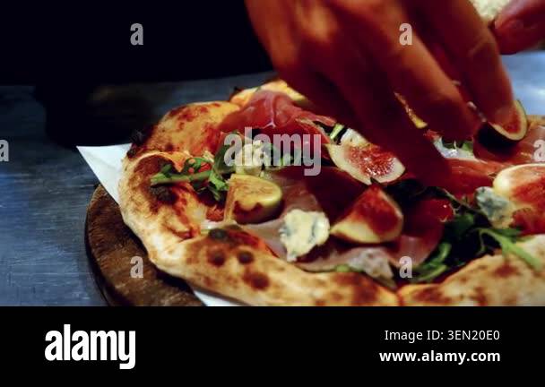 Authentic pizza making process in traditional Italian pizzeria, while ...