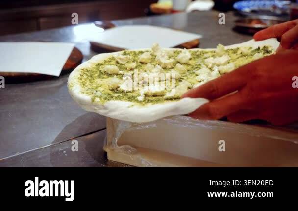 Authentic pizza making process in traditional Italian pizzeria, while ...