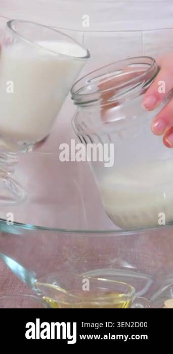 Female hands making soft layered cruffin dough with butter, dried ...