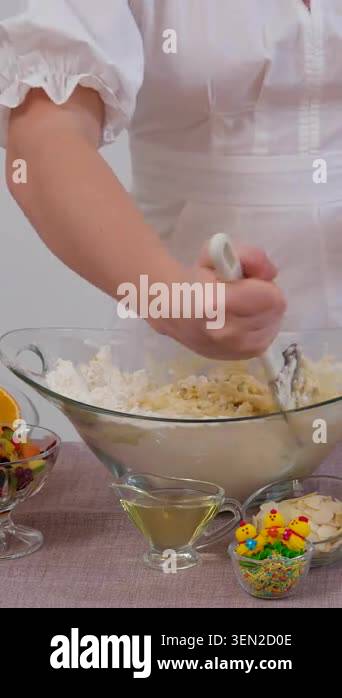 Female hands making soft layered cruffin dough with butter, dried ...