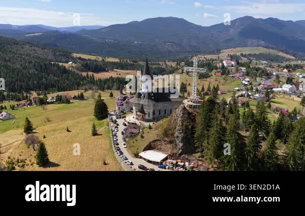 Aerial drone view of the large metal cross and Romanian flag near ...