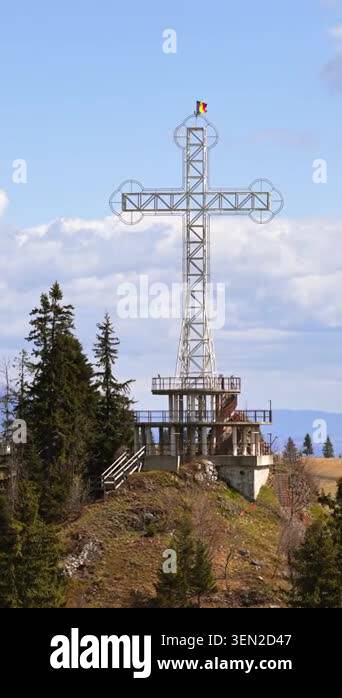 Aerial drone view of the large metal cross and Romanian flag near ...