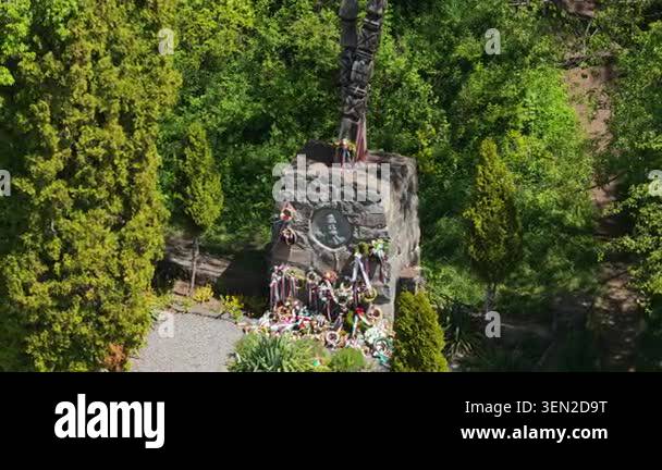 Overhead aerial view of a stone monument decorated with floral wreaths ...