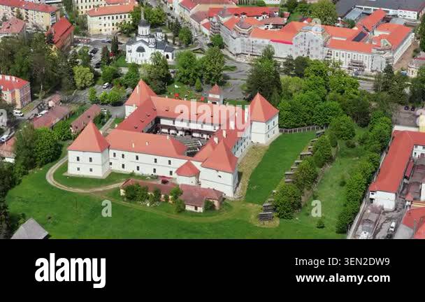 Aerial drone view of a historic fortress with red corner towers and an ...