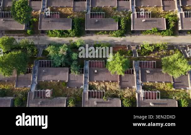 Aerial drone footage flying over a deserted residential complex ...