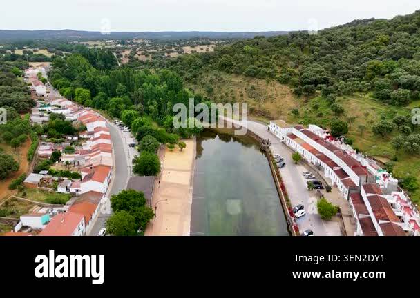 Breathtaking aerial backwards flight revealing the charming town of San ...