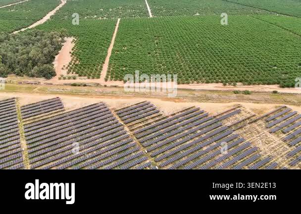 Aerial view showing a large photovoltaic power station with rows of ...