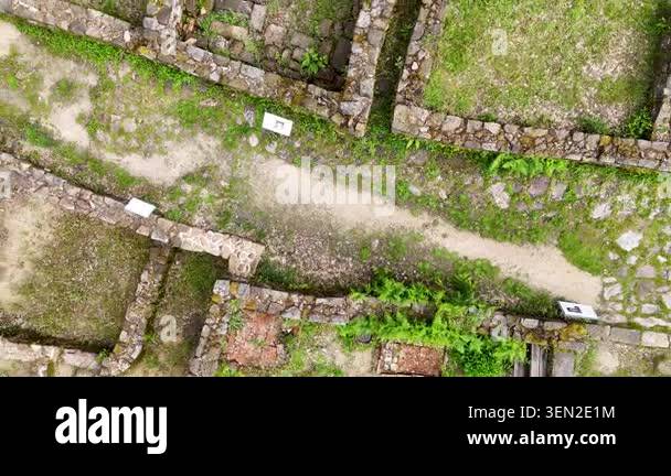 Aerial view circling over the ancient stone ruins of Castro de Armea ...