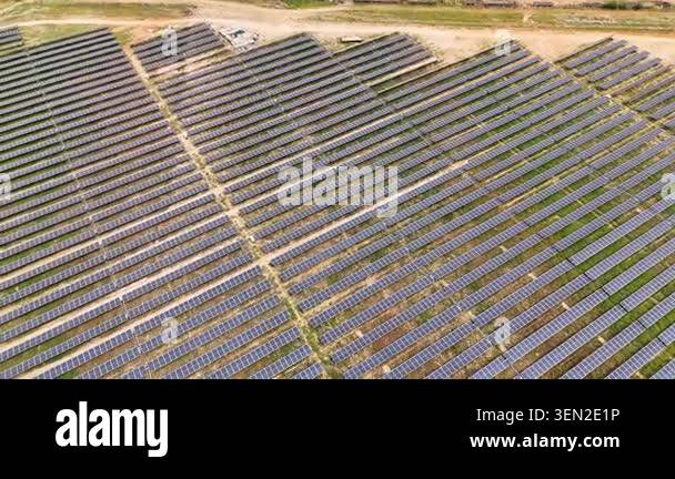Large industrial solar farm producing clean, renewable energy. Aerial ...