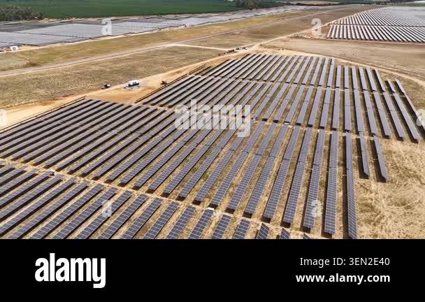 Huge solar farm with rows of photovoltaic panels generating clean ...
