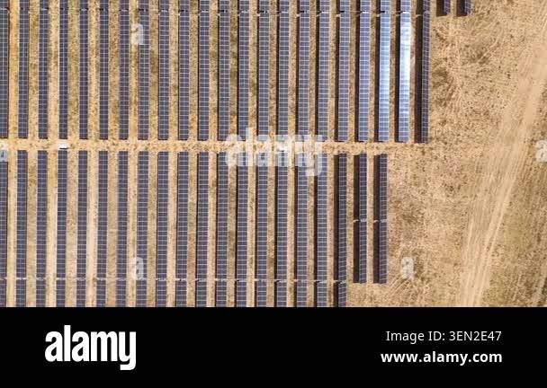 Top down aerial view of a solar panel farm producing renewable and ...