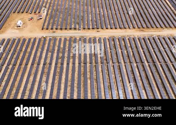 Extensive solar farm with countless photovoltaic panels arranged in ...