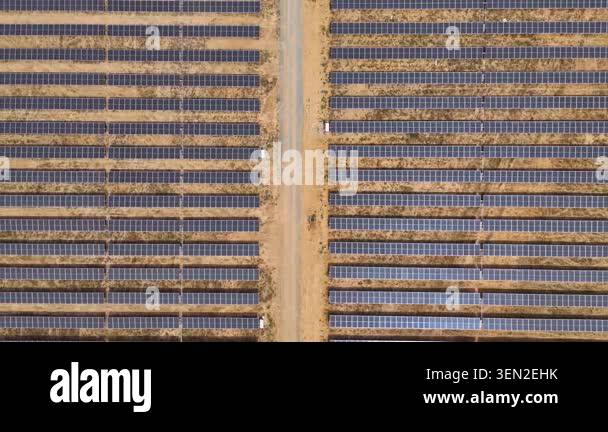 Immense solar farm with rows of photovoltaic panels generating ...