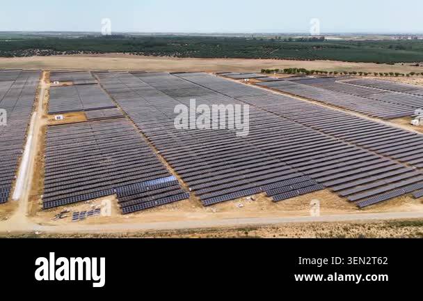 Immense solar farm with rows of photovoltaic panels in a rural ...