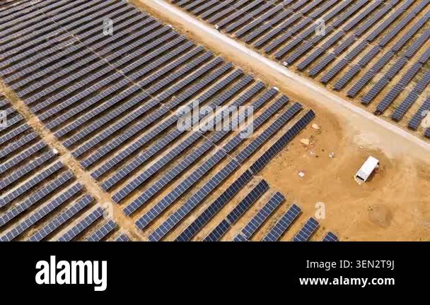 Vast solar farm with photovoltaic panels generating clean, renewable ...
