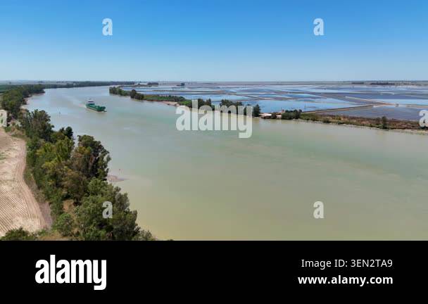 Aerial view of a large cargo vessel transporting goods along the ...
