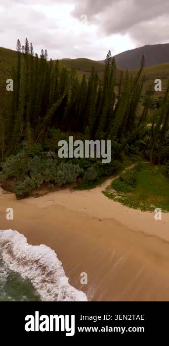 Rugged coastal cliffs and sea, aerial drone survey captures eroded rock ...
