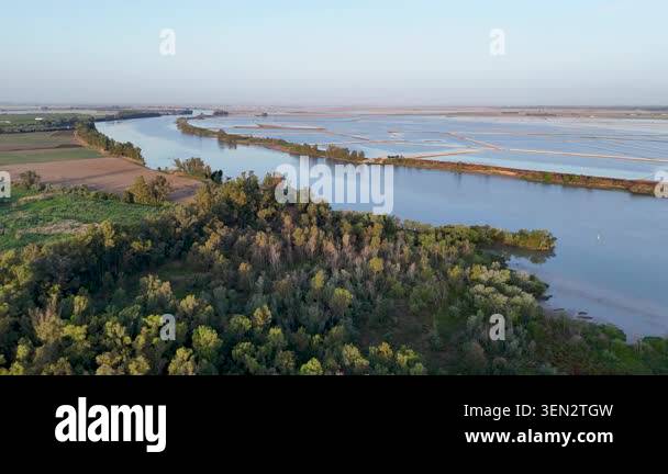 Scenic aerial shot of the Guadalquivir river winding through the ...