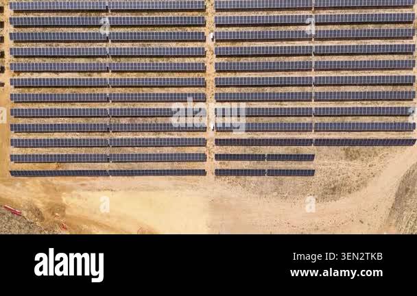 Aerial perspective of a large scale solar power plant under ...