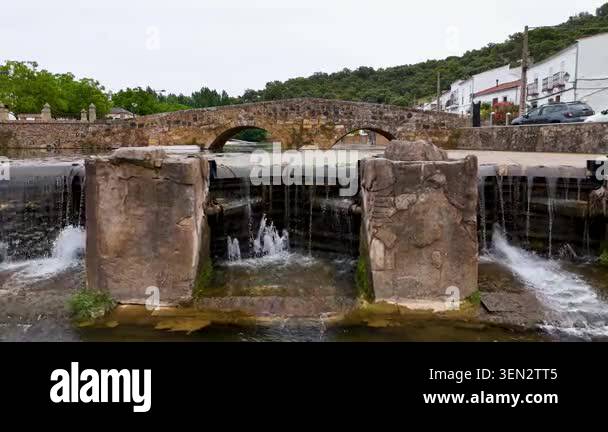 San Nicolas del Puerto, Spain, May 28, 2026: Water cascading over a ...