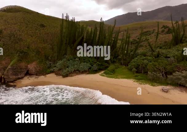 Rugged coastal cliffs and sea, aerial drone survey captures eroded rock ...