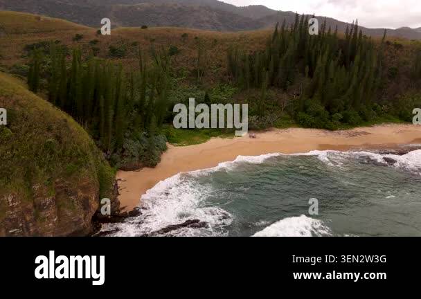 Rugged coastal cliffs and sea, aerial drone survey captures eroded rock ...