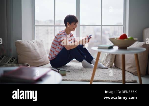 Woman enjoy entertainment content smartphone sitting luxury home ...