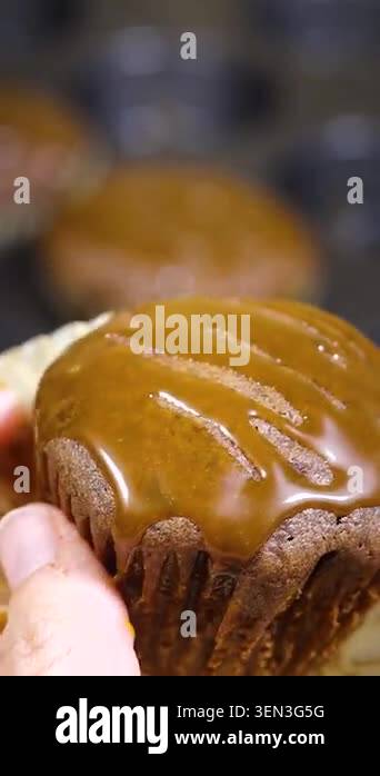 Rich Chocolate and caramel Muffin in a Fluted Paper Liner Stock Video ...