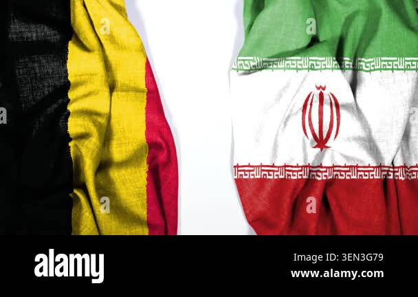waving national colorful flag of belgium and national flag of iran ...