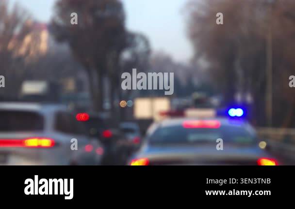 blurred bokeh video of a city street traffic jam in the evening with ...