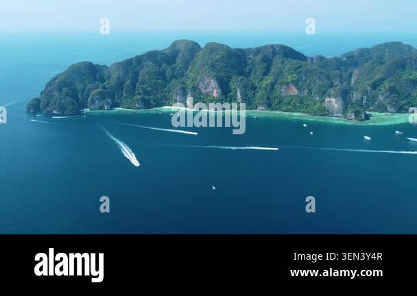 Aerial view revealing the stunning limestone cliffs and turquoise ...
