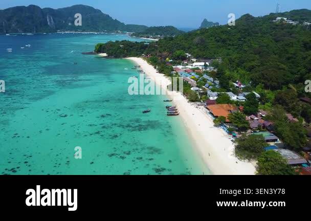 Aerial footage showing the beautiful tropical coastline of phi phi ...