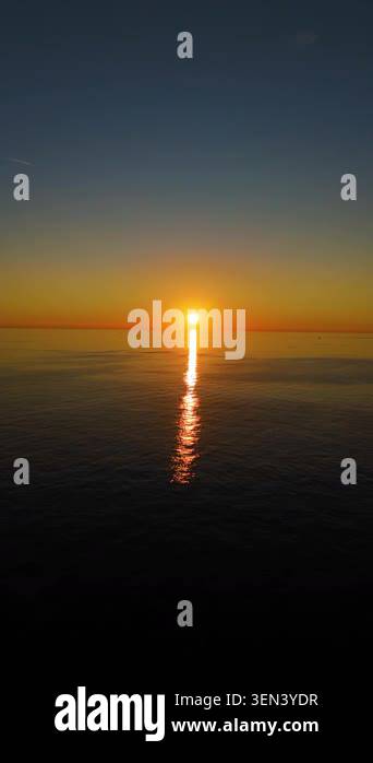 Beautiful golden sunset over the calm adriatic sea in rovinj, croatia ...