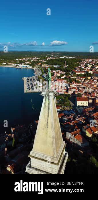 Aerial view descending along the bell tower of the church of st ...