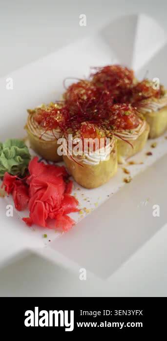 Gourmet baked sushi roll set with fresh salmon, cream cheese, wasabi ...