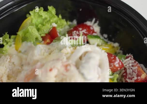 Fresh seafood caesar salad with shrimp, calamari, lettuce, and tomatoes ...