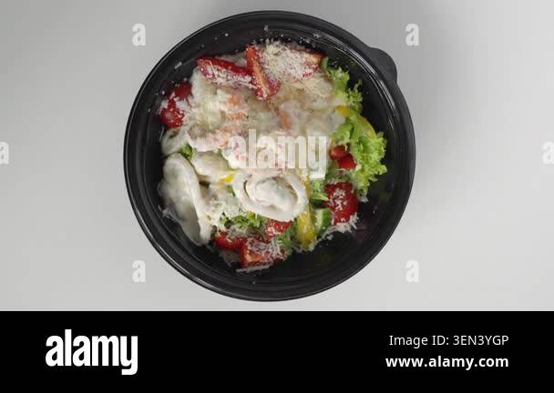 Delicious rotating seafood salad with fresh vegetables, creamy dressing ...
