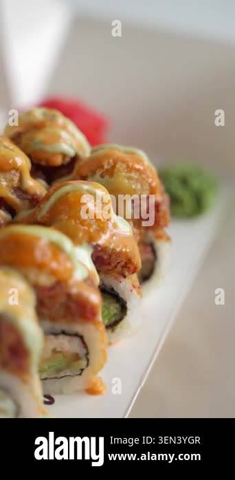Macro shot of Japanese sushi rolls with spicy tuna, avocado, and cream ...